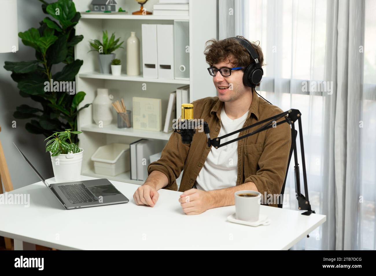 Host channel of influencer using headphone and mic talking with ...