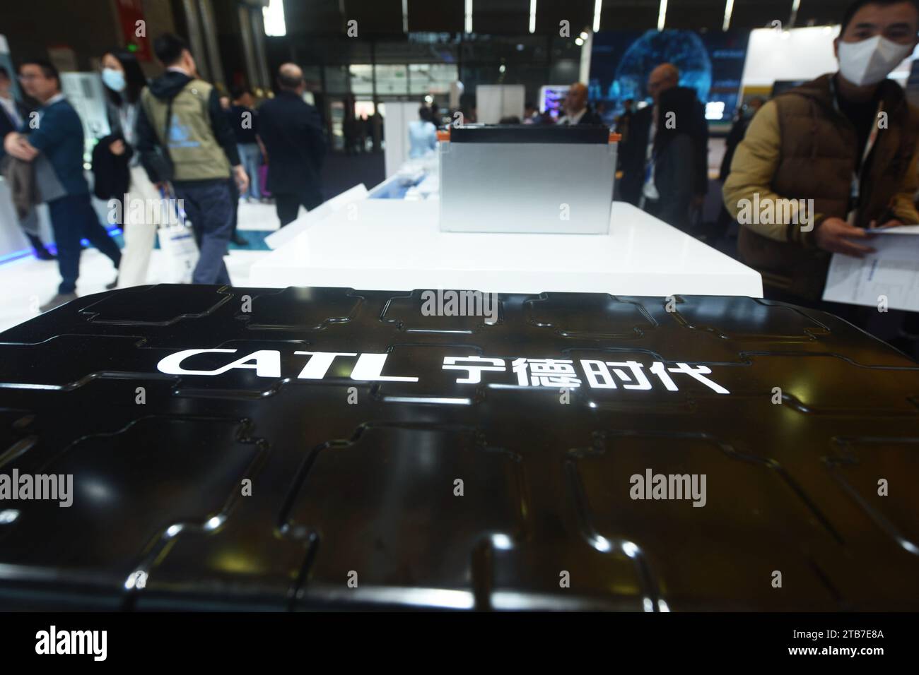 SHANGHAI, CHINA - DECEMBER 5, 2023 - Visitors look at a large lithium ...
