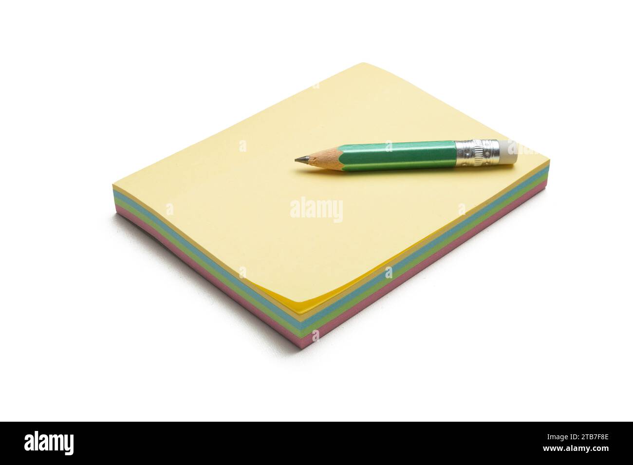Block of colored sticky notes with a green pencil Stock Photo - Alamy