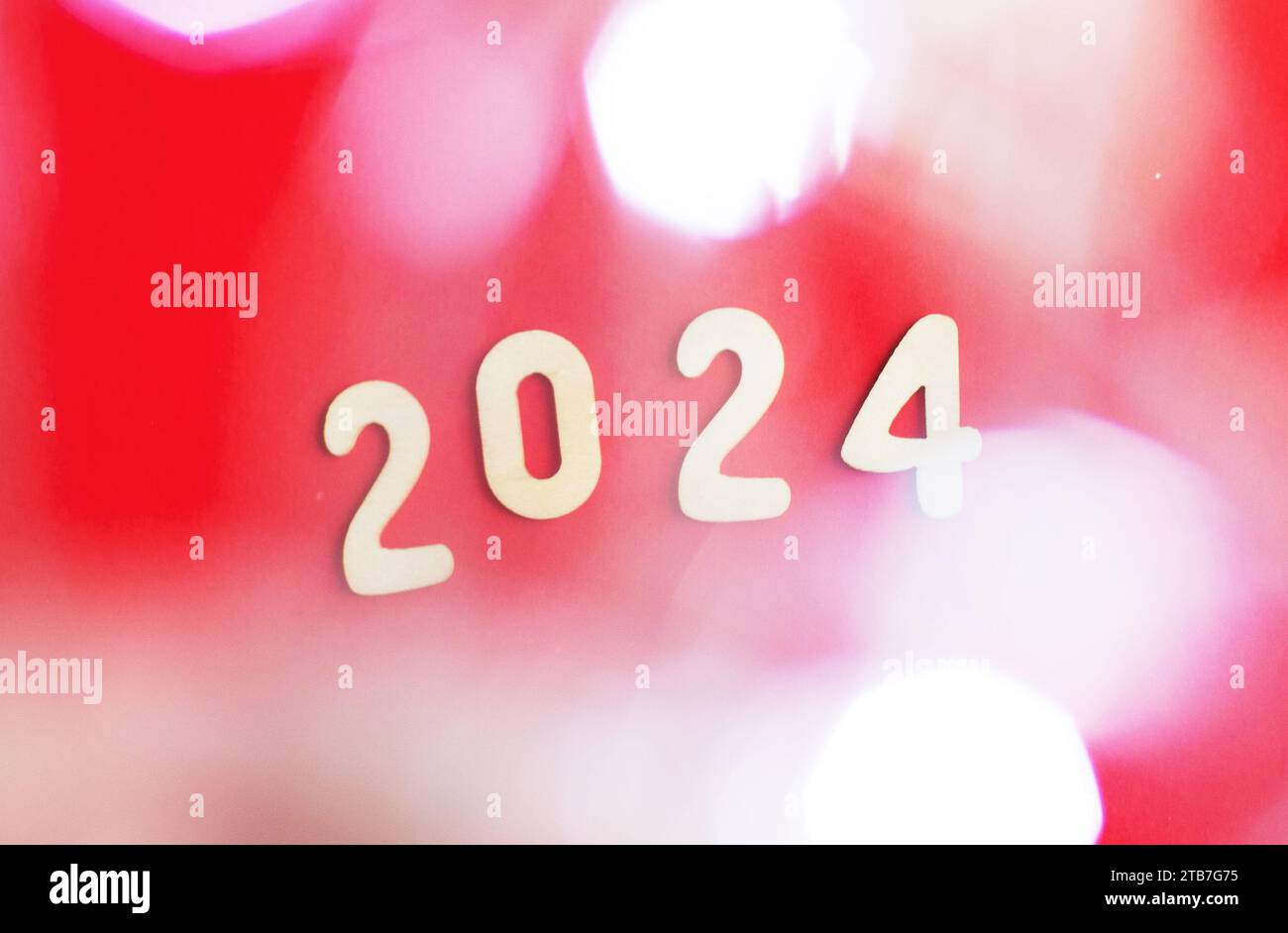 wooden number 2024 on christmas beautifull shiny red background with ...