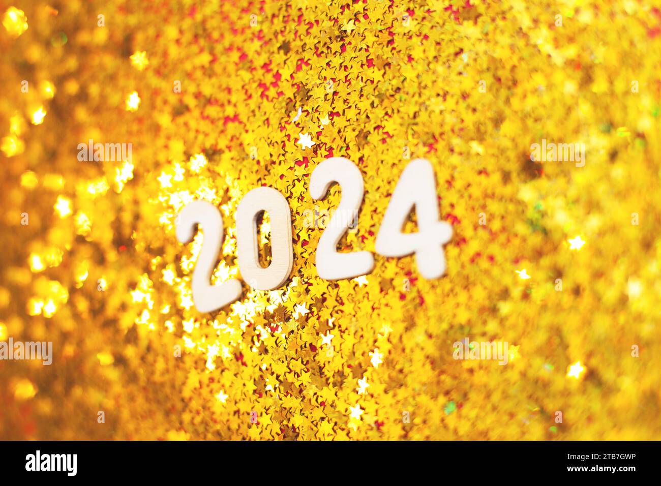 wooden number 2024 on christmas shiny golden background with sparkle ...