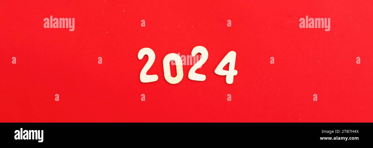 Wooden numbers 2024 on red background. Christmas, New Year, winter ...