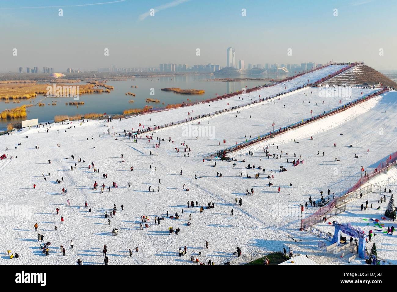 Tourists enjoy skiing at a ski resort in Yinchuan City, northwest China ...