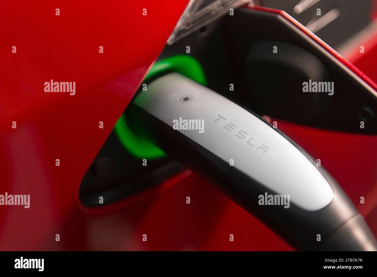 Charging a Tesla electric vehicle. Wall Connector cable and plug ...