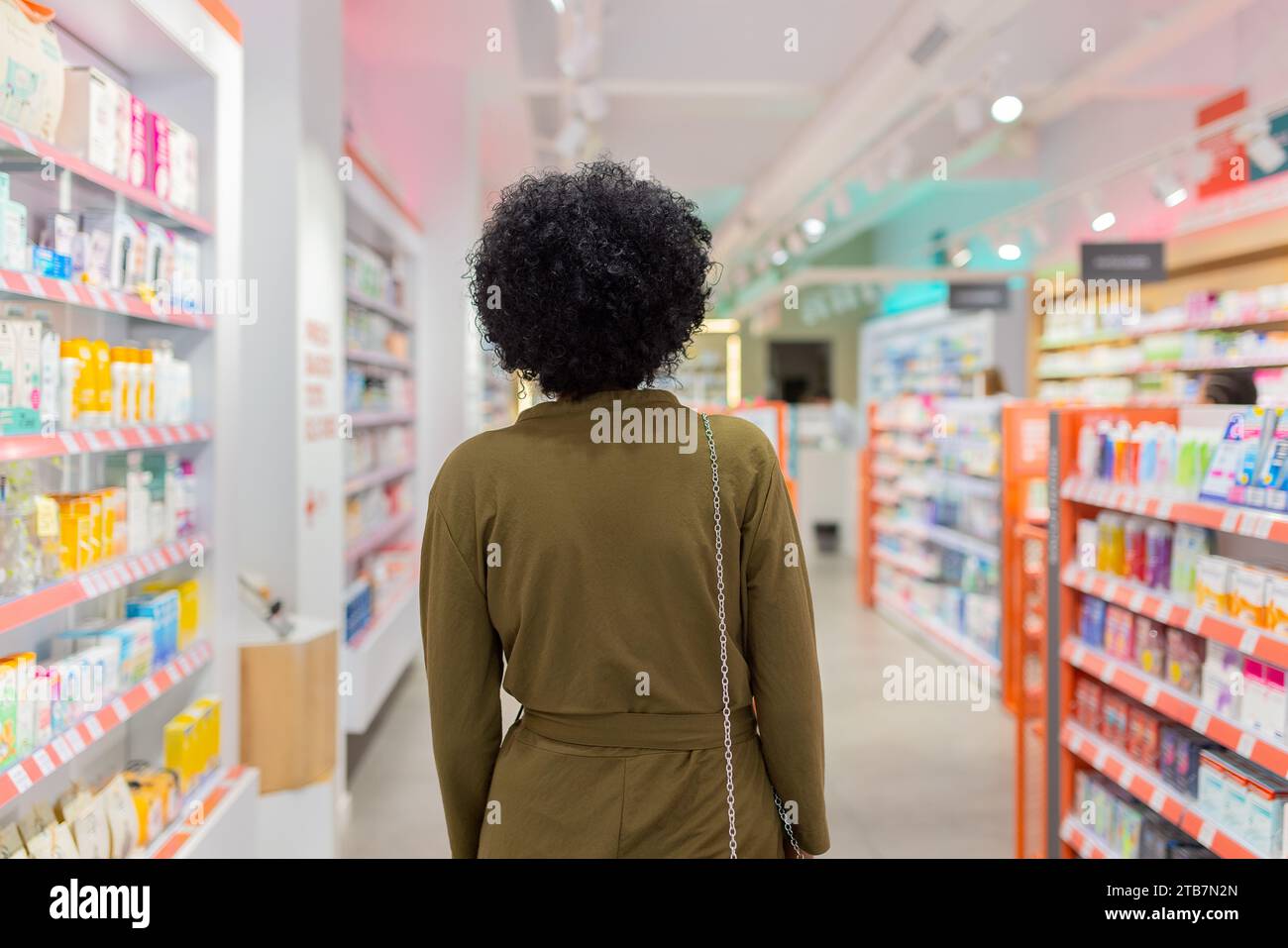 Back view of African American young woman with afro hair while standing ...