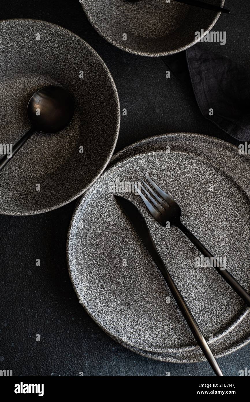 An artistic shot of a modern tableware set, including plates and ...