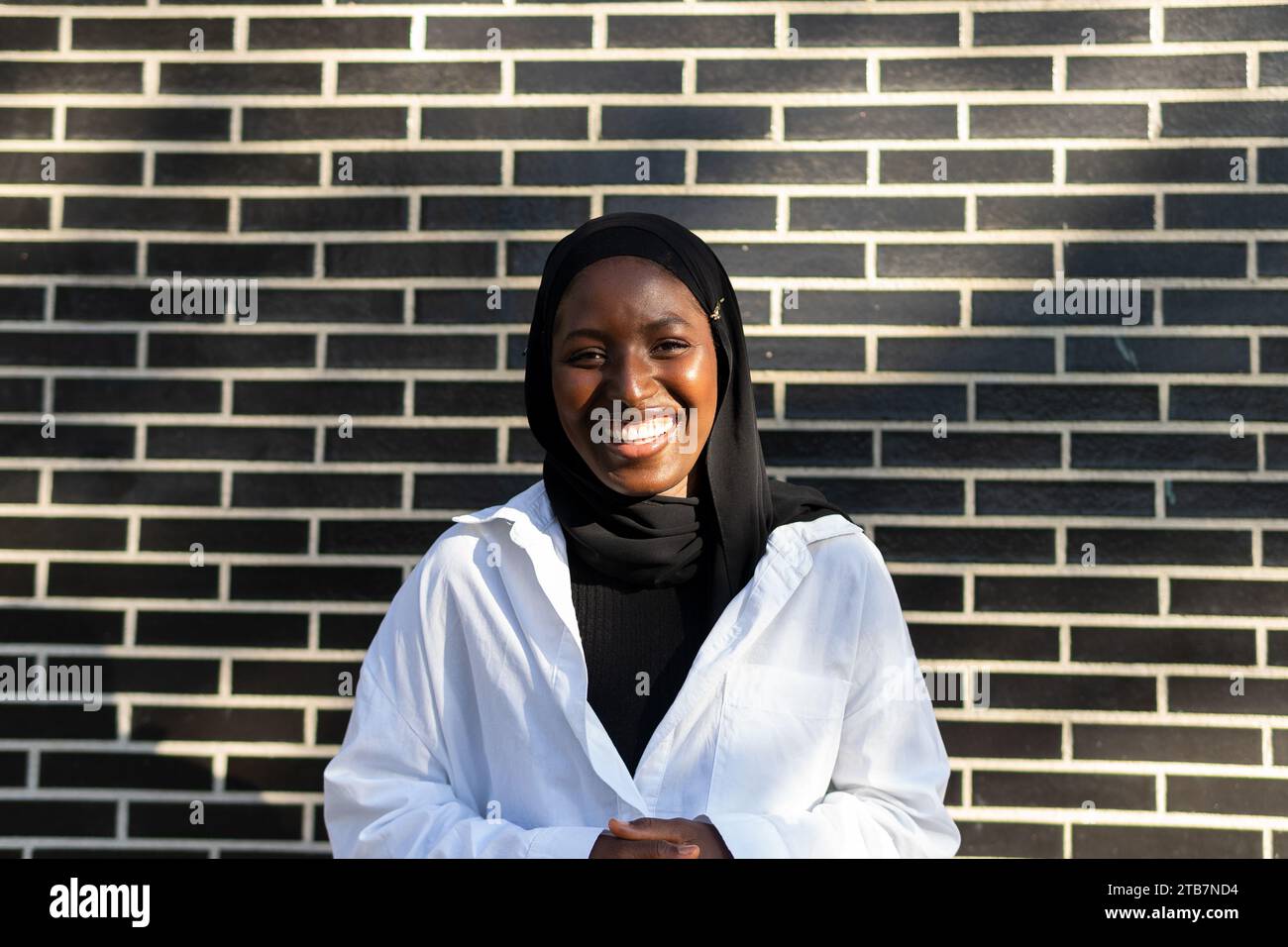 Happy african american muslim hi-res stock photography and images - Alamy