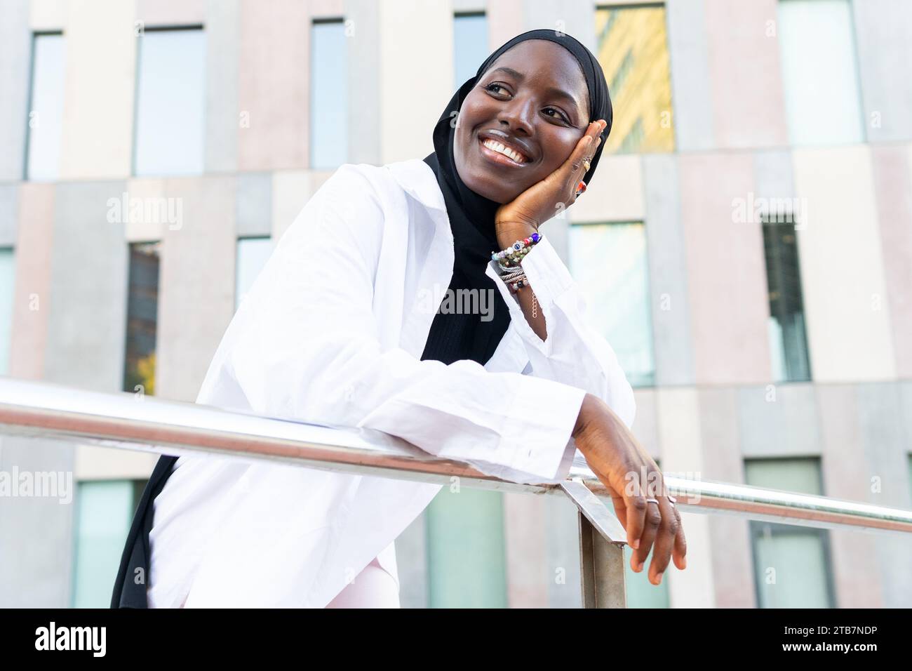 From below cheerful African American Muslim businesswoman in black ...