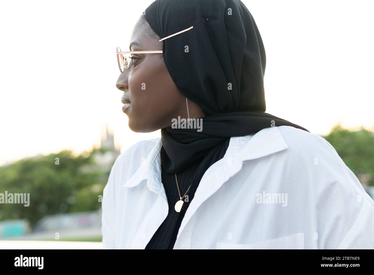 Stylish thoughtful female Muslim professional wearing black headscarf ...