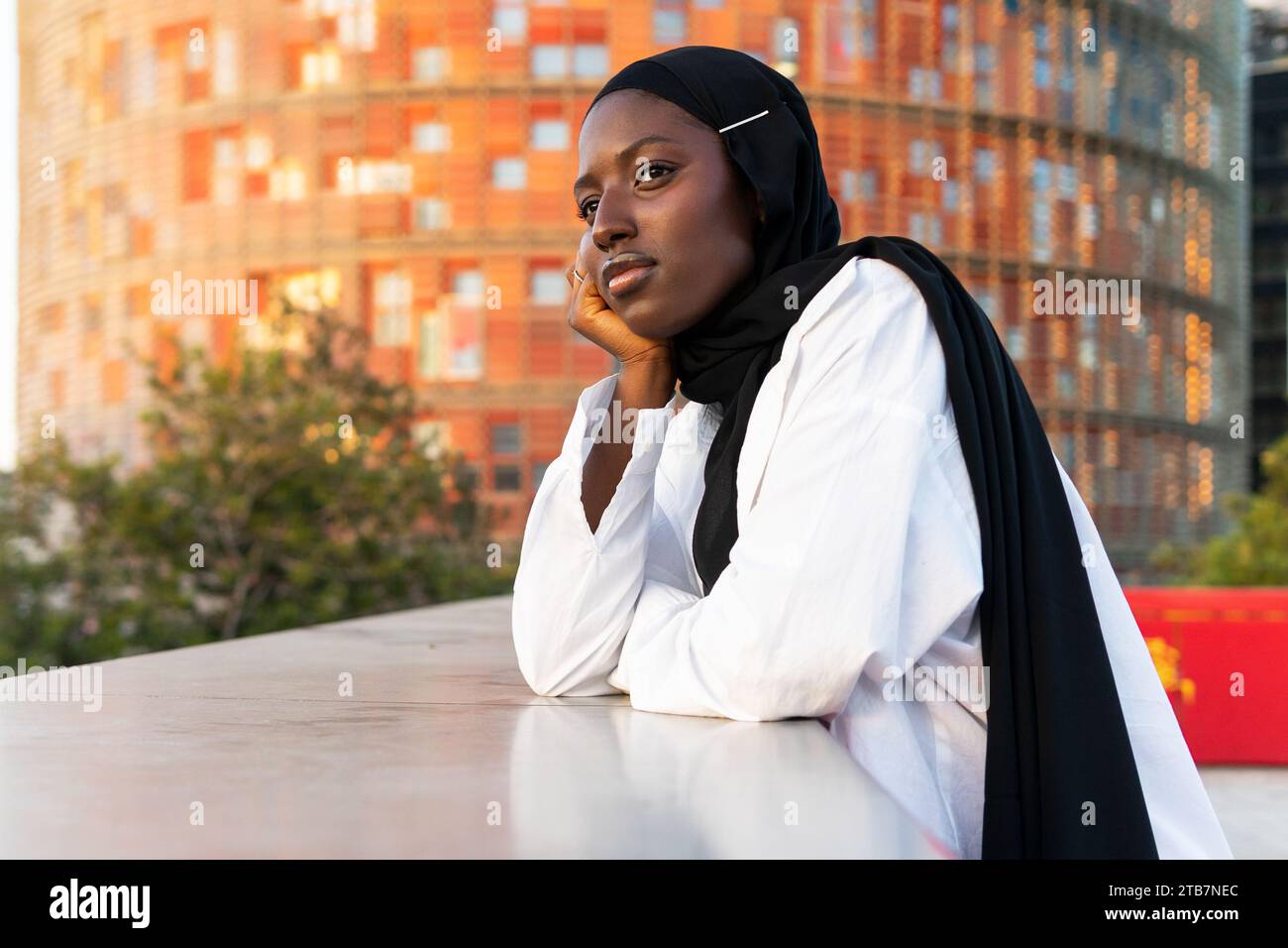 Side view of thoughtful African American Muslim businesswoman in black ...