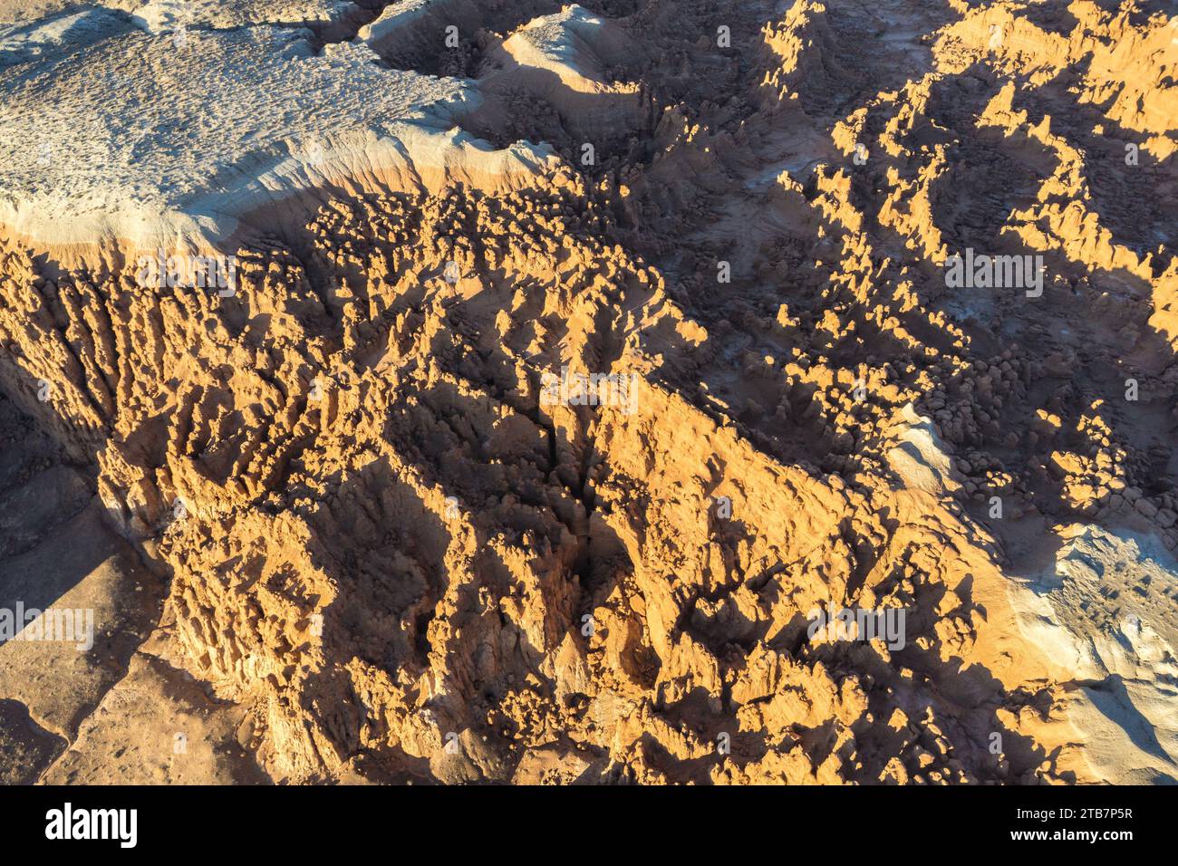 The photo captures the warm hues and dramatic shadows of desert canyons ...