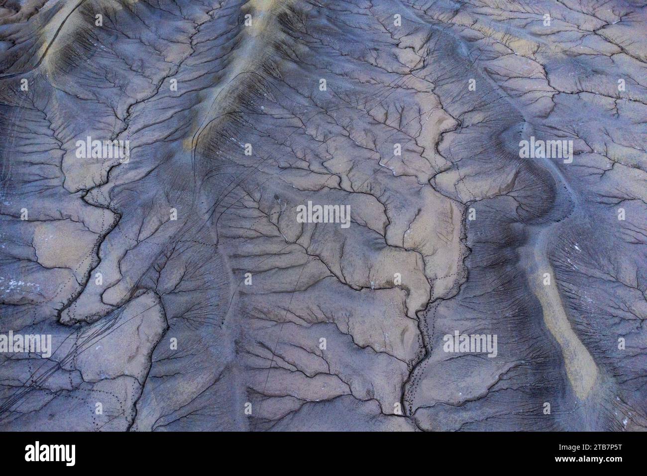 Abstract natural art forms as blue sand exhibits intricate patterns ...