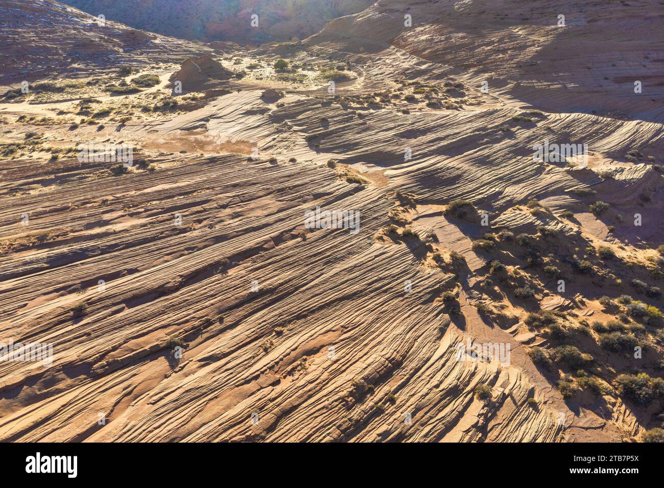 Aerial shot capturing the intricate patterns of desert rock formations ...