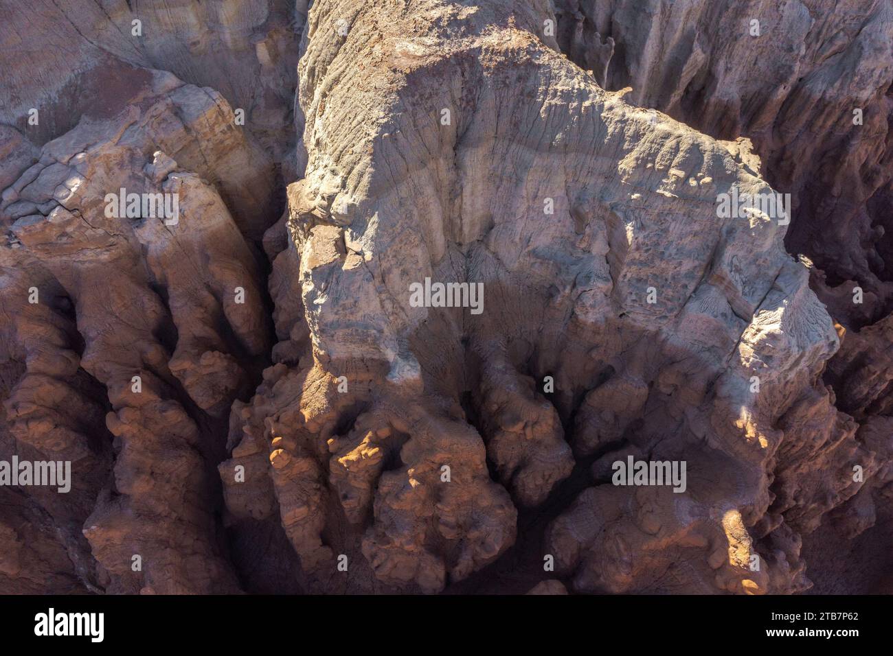 An aerial shot captures the intricate textures of towering mountain ...