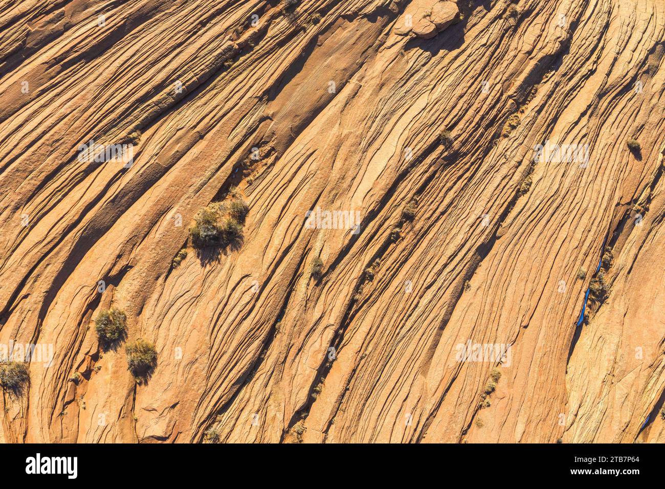 An aerial shot captures the intricate, wavy patterns of rock formations ...