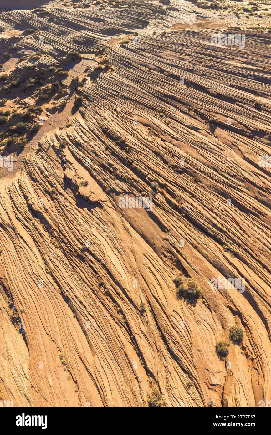 Aerial shot capturing the intricate patterns of eroded rock strata in a ...