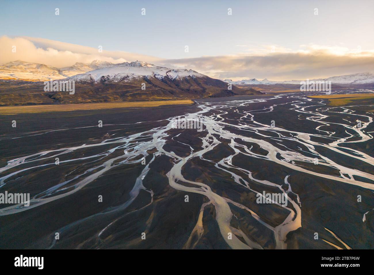 A stunning aerial shot of meandering braided river patterns amidst the ...
