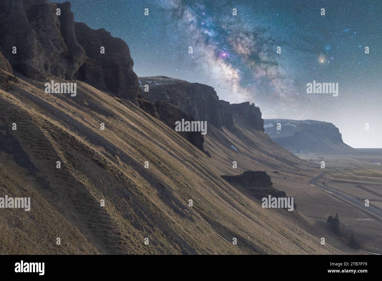 Majestic view of Milky Way stretching its stellar arc over a deserted ...
