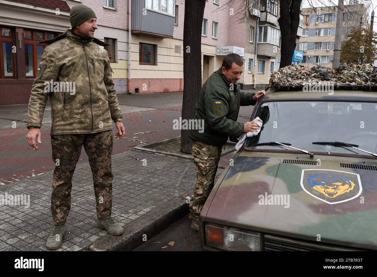 A Ukrainian army soldier seen cleaning the windshield of their ...