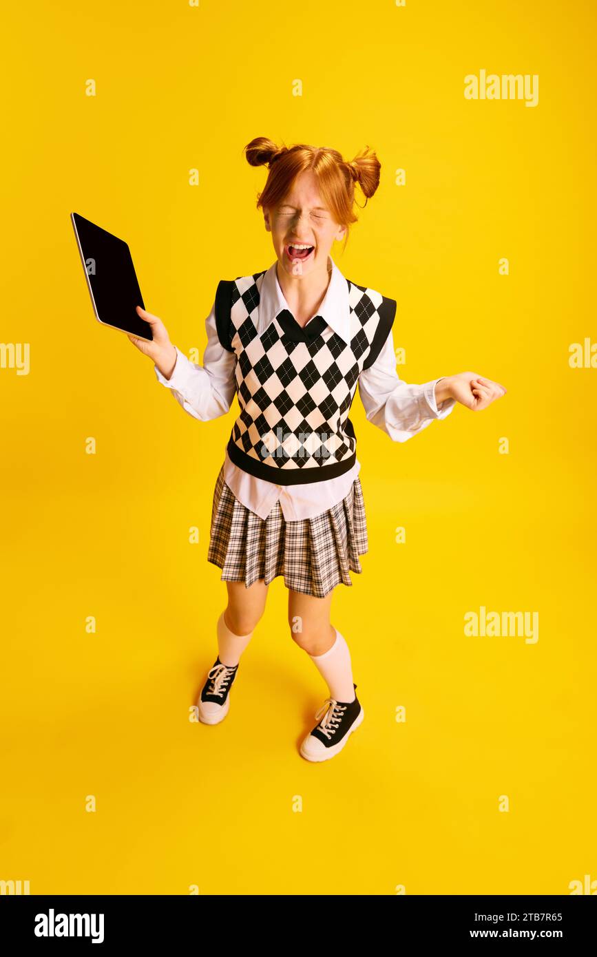 Top view portrait of loudly shouting of joy and happy young girl ...