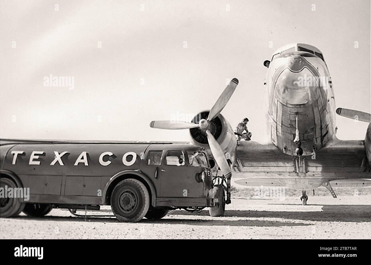 1935 Diamond T Doodlebug refueling a DC-3 - Vintage car picture Stock ...