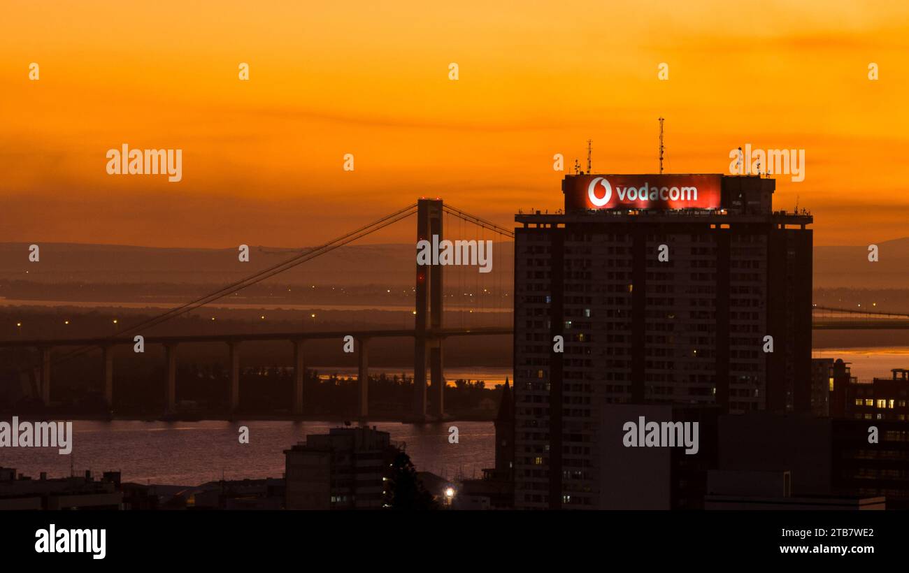 The city of Maputo with buildings and the Maputo bridge at sunset Stock ...