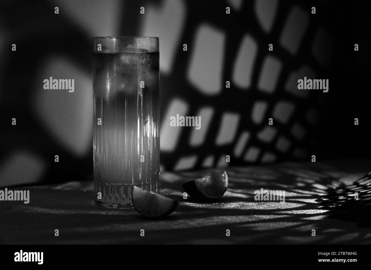 Dark and stormy cocktail with green background Black and White Stock ...