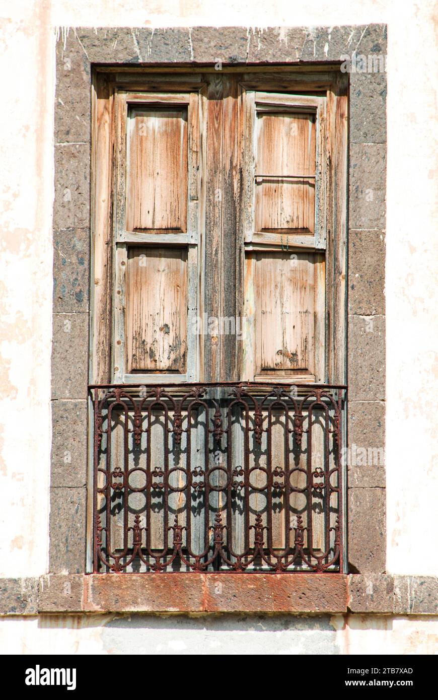 beautiful antique wooden window with metal rail and stone frame Stock ...