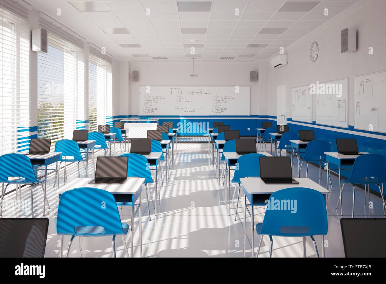 An expansive, sunlit classroom outfitted with open laptops, signaling a ...