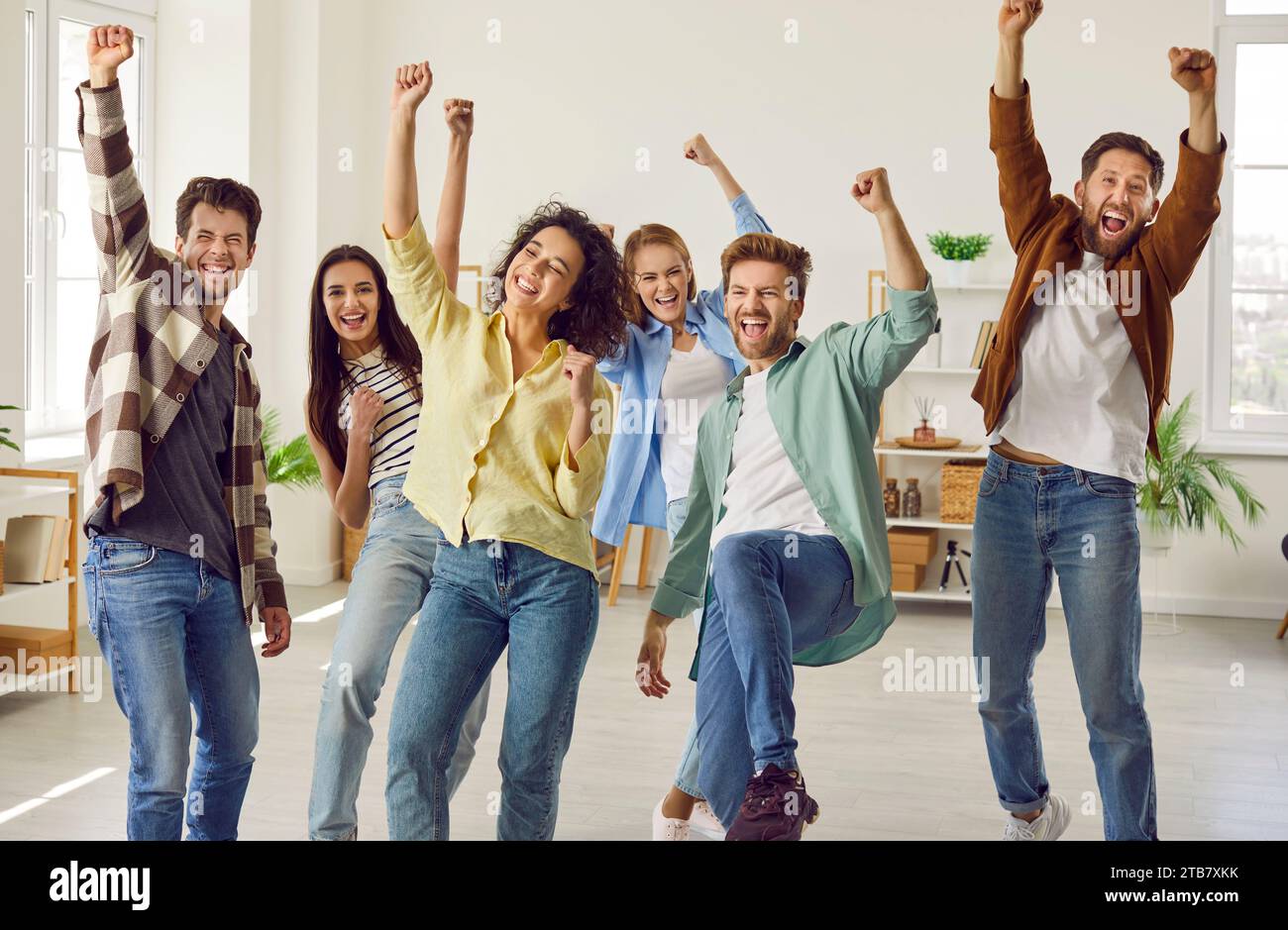 Funny happy overjoyed group of people friends celebrating success ...