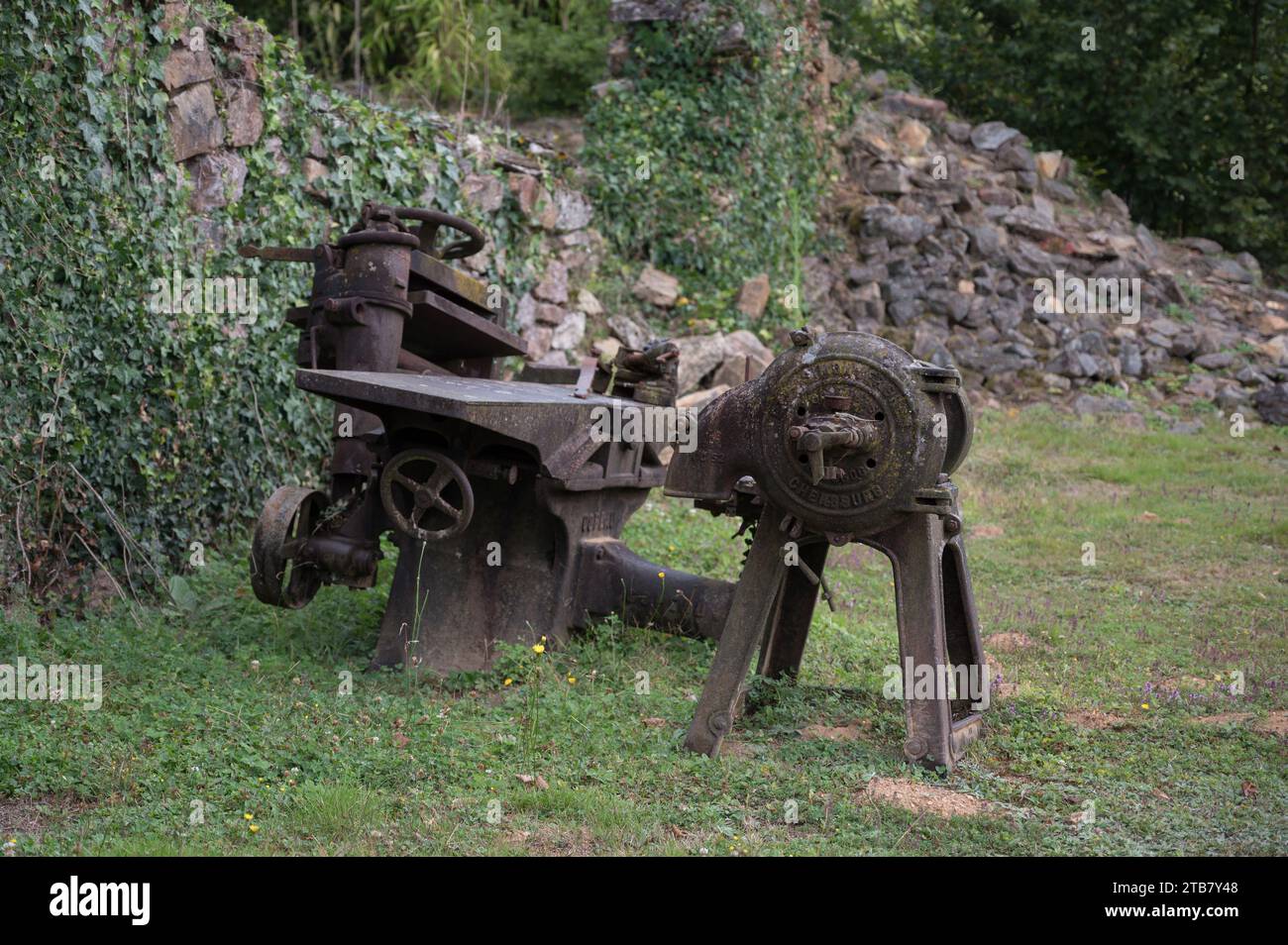Remains of rusty machines from an old factory abandoned in the war ...