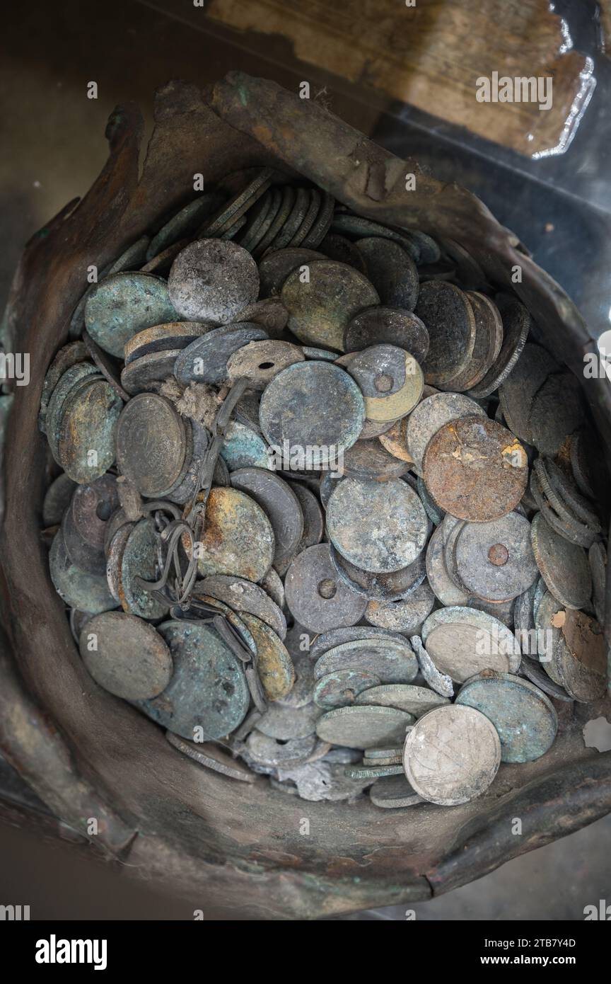 Metal jar with French coins recovered from the massacred and burned ...
