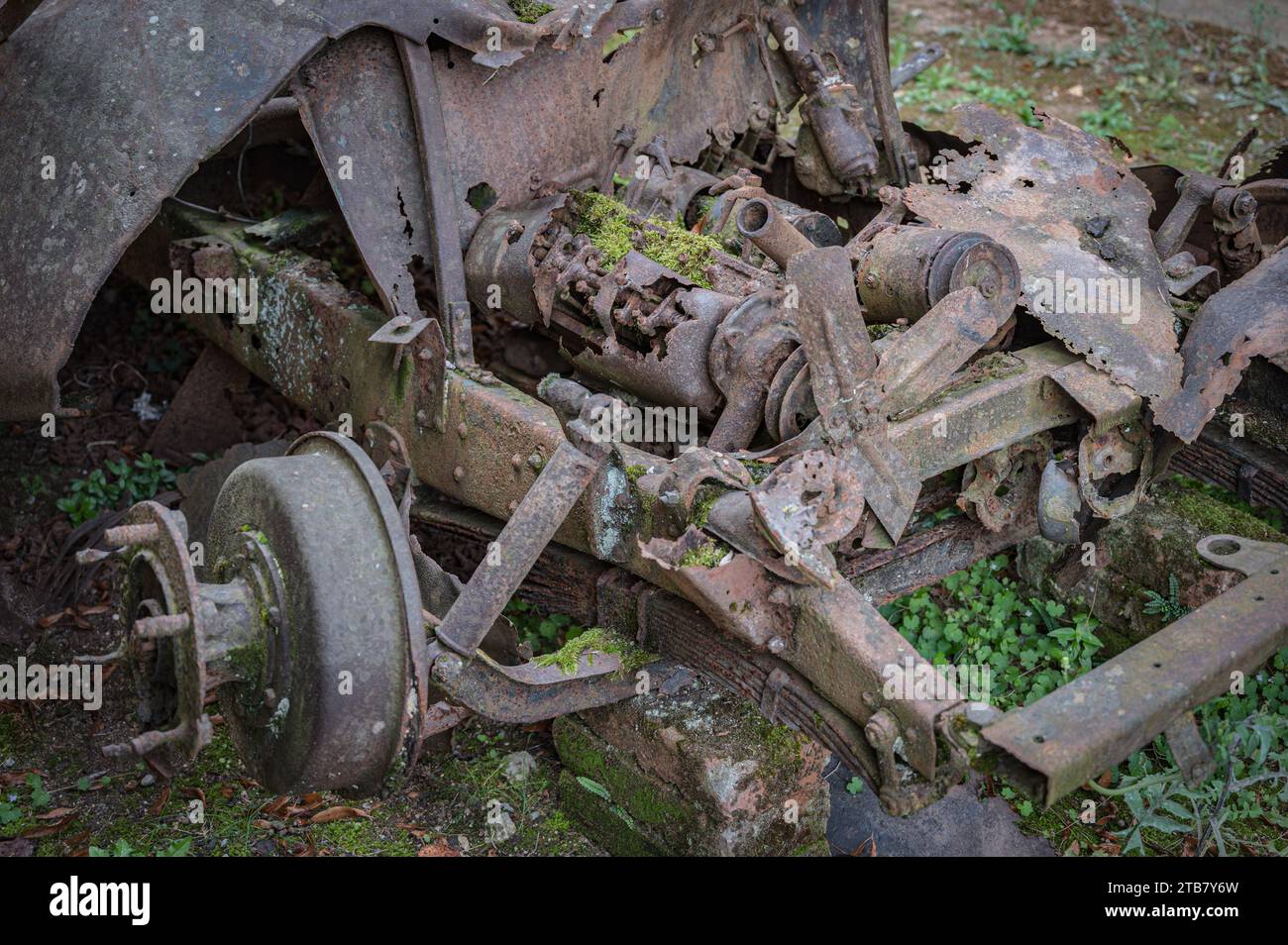 Detail of the engine of an old abandoned historic car, it has a broken ...