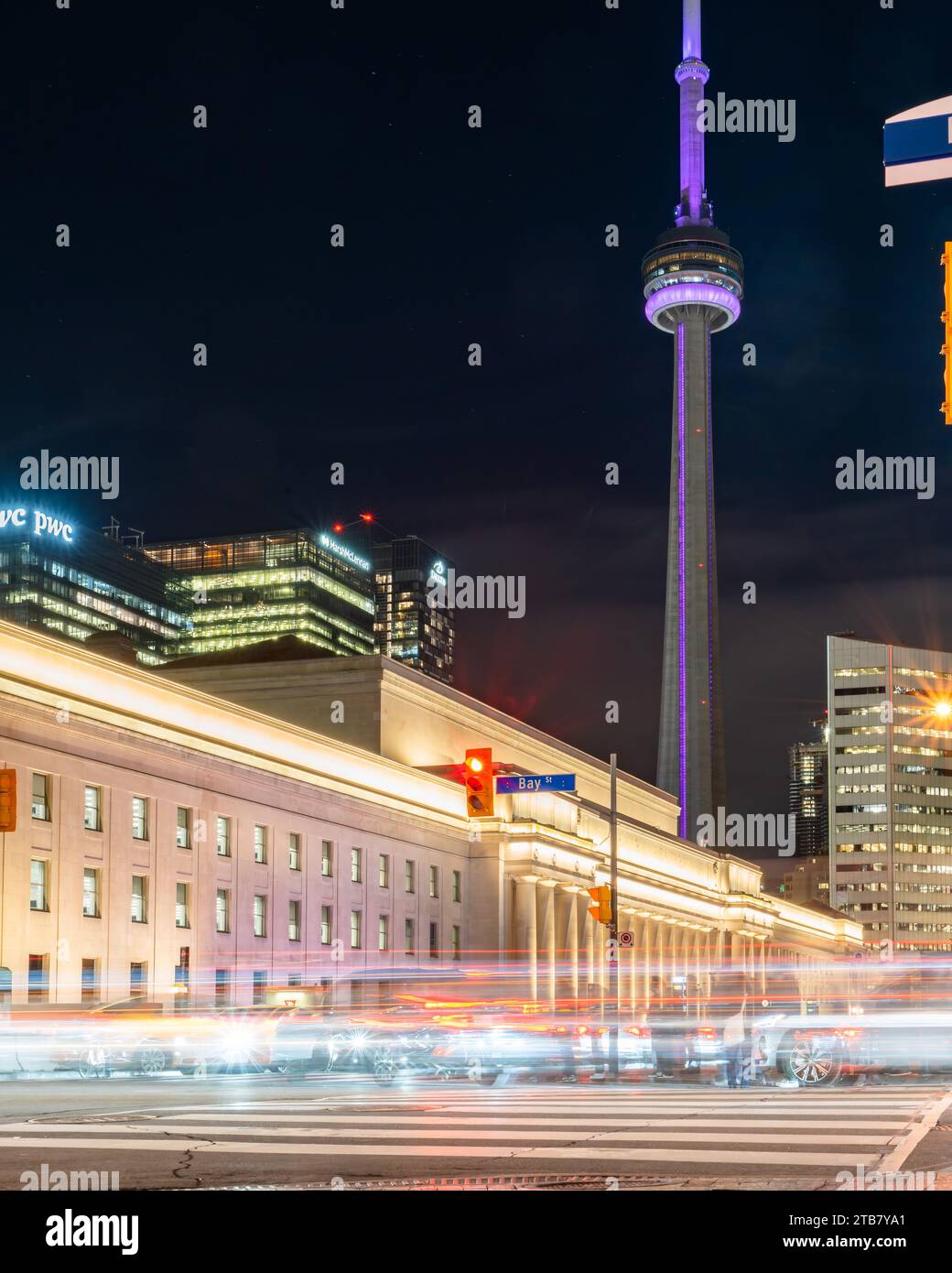 A vertical of Toronto Union Station and CN tower at night Stock Photo ...