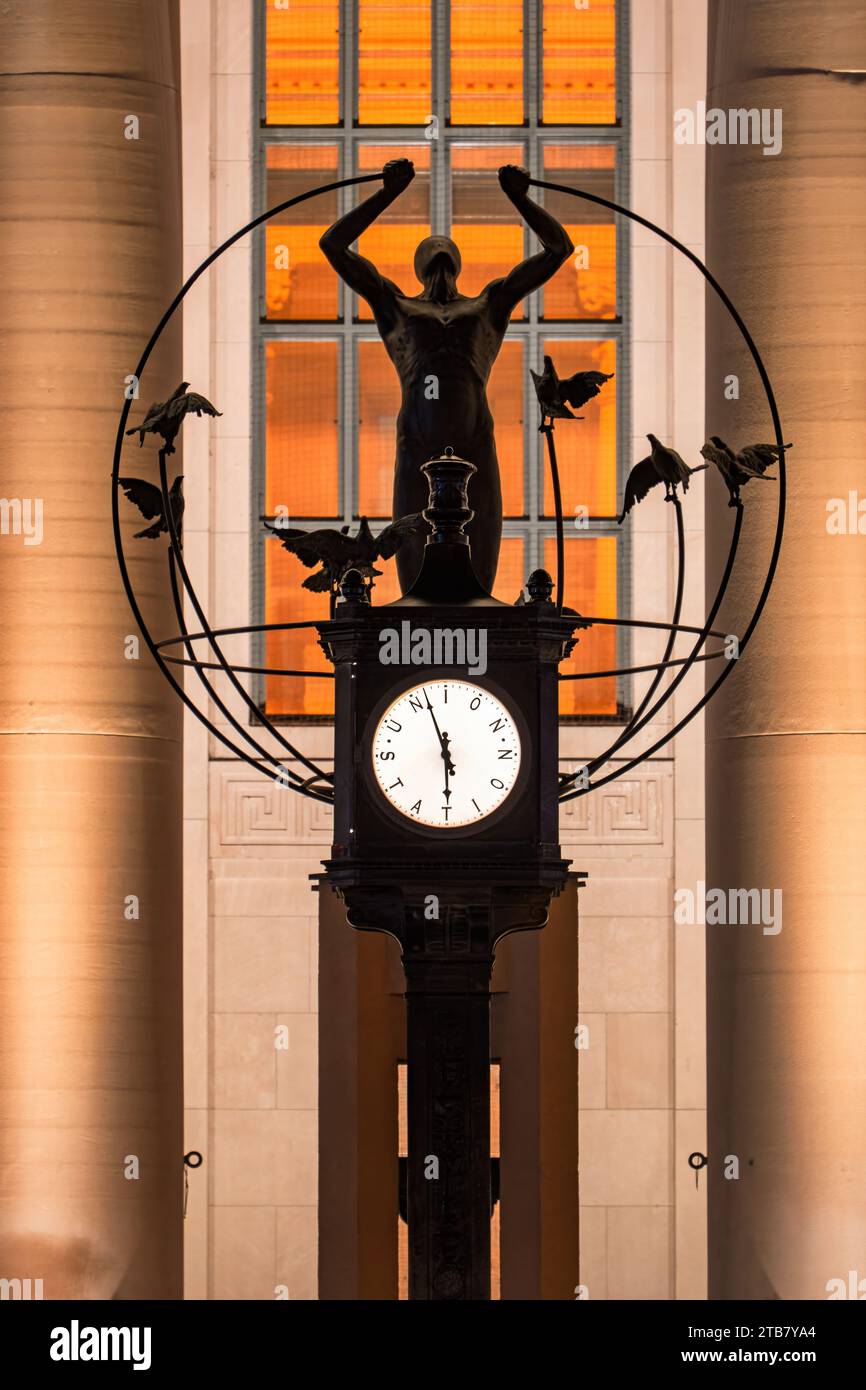A vertical of Toronto Union Station Outdoor Clock with Statue behind it ...