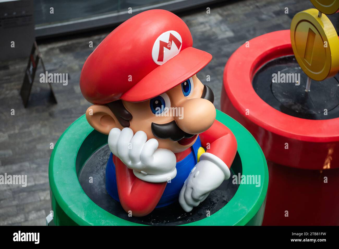 Top down view of the popular game character Super Mario in green pipe ...