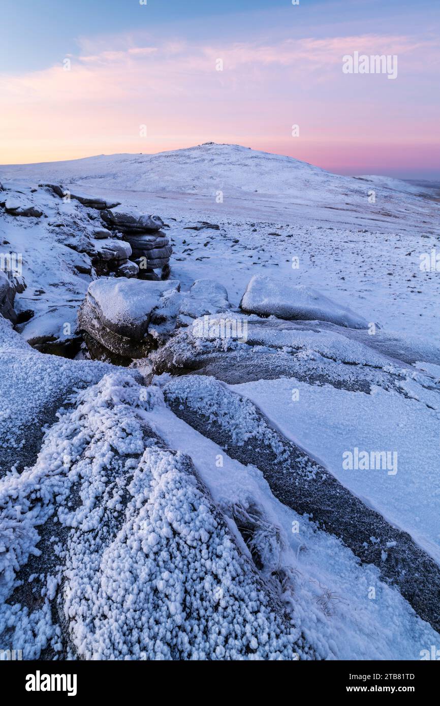 Snow and ice covered moorland at dawn on West Mill Tor in Dartmoor ...