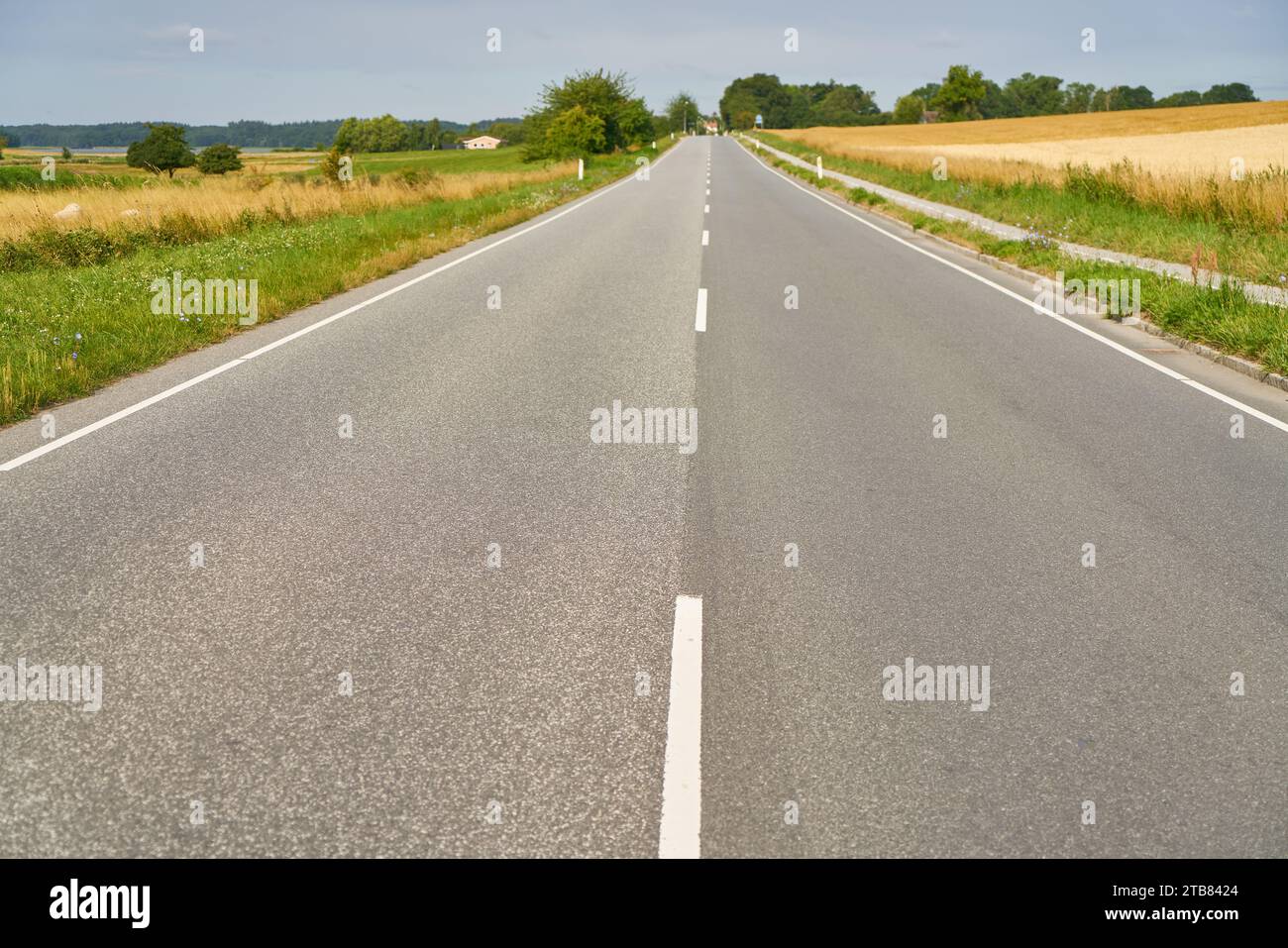 Asphalt road through the field hi-res stock photography and images - Alamy