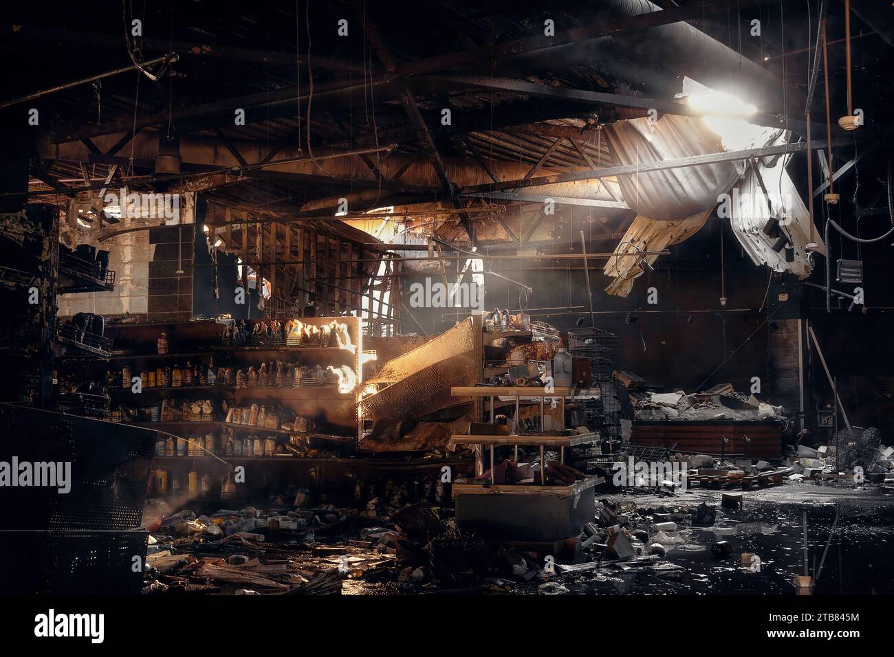 A ray of sunlight breaks through the roof of a grocery store destroyed ...