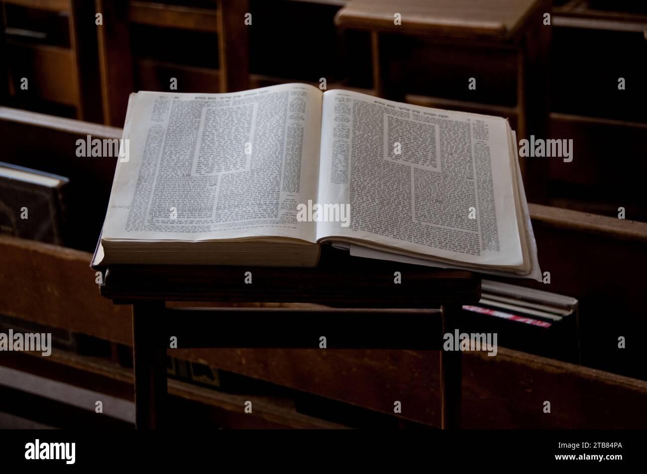 An open book of the Talmud on a prayer stand showing the unique page ...