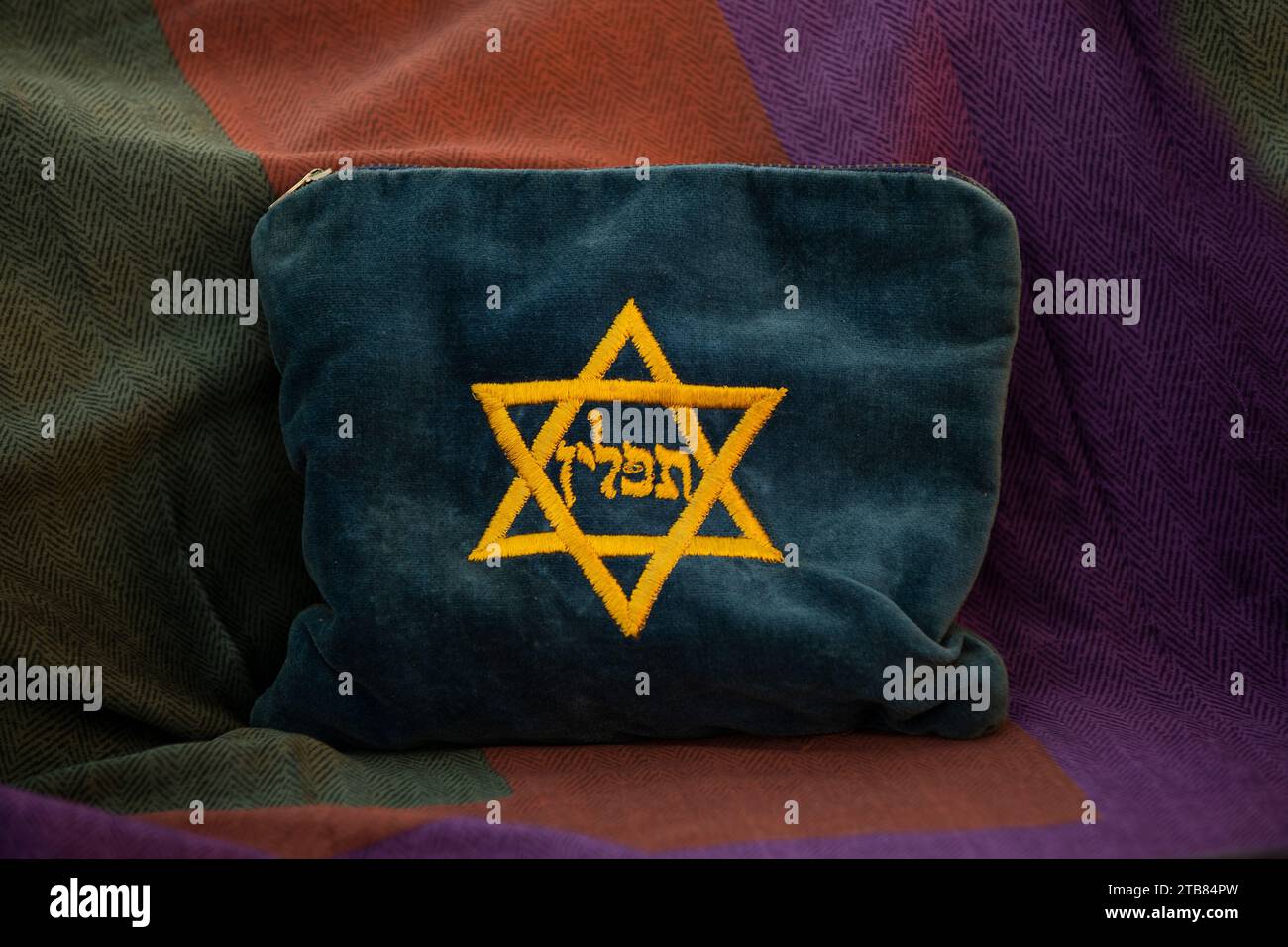 A green cloth case used to hold the tefillin worn during Shacharit, the ...