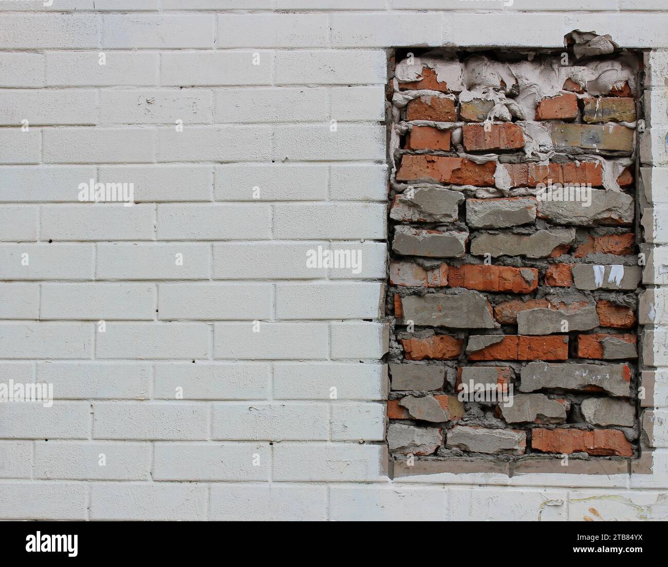 Blocked rough brickwork window on a white brick wall textured photo for ...