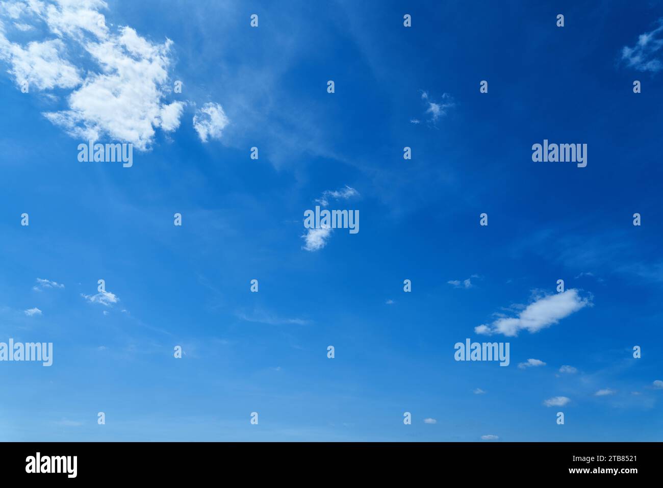 Open blue sky with some little white clouds in the air Stock Photo - Alamy