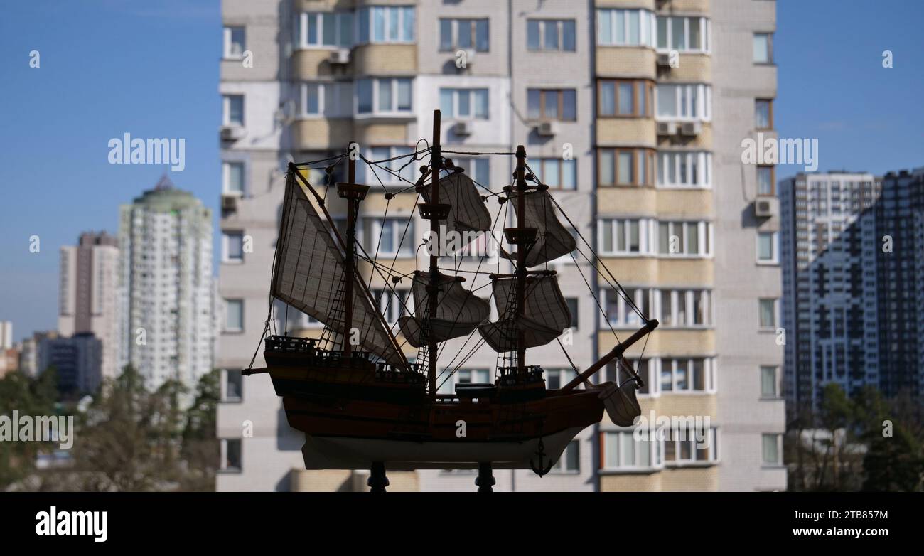 Defocused Cityscape Panorama With Wooden Sailing Ship Model On A ...