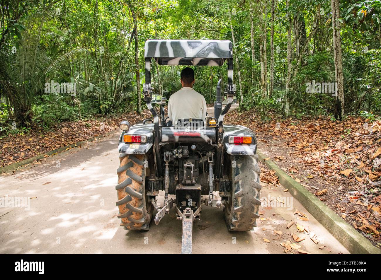 A tractor pulling a cart at the Hacienda Napoles theme park in Colombia ...