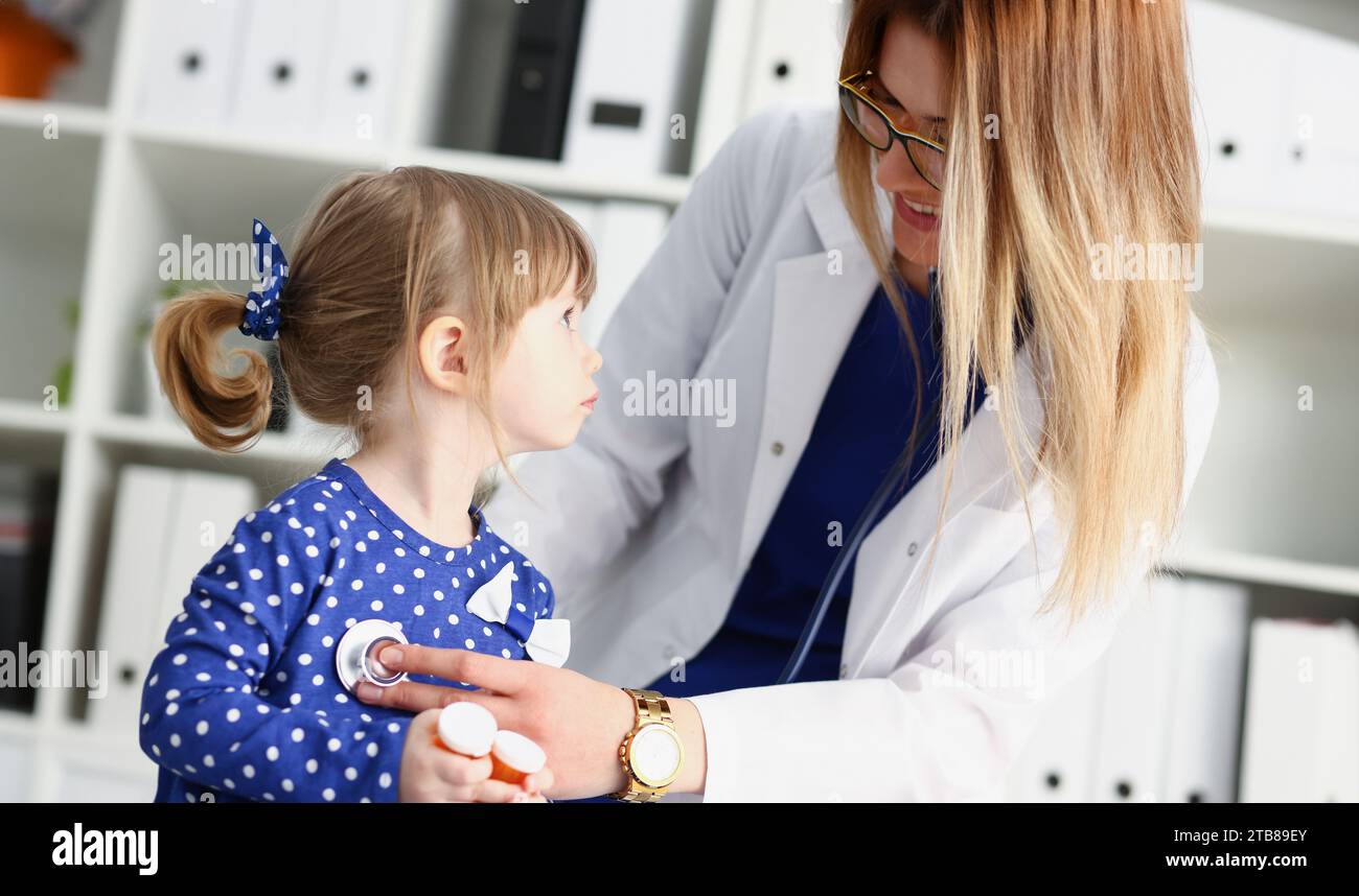 Little child with stethoscope at doctor reception Stock Photo - Alamy
