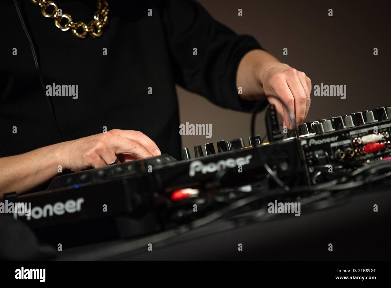 DJ (disc jockey) party set with Pionneer mixing console, black tee ...