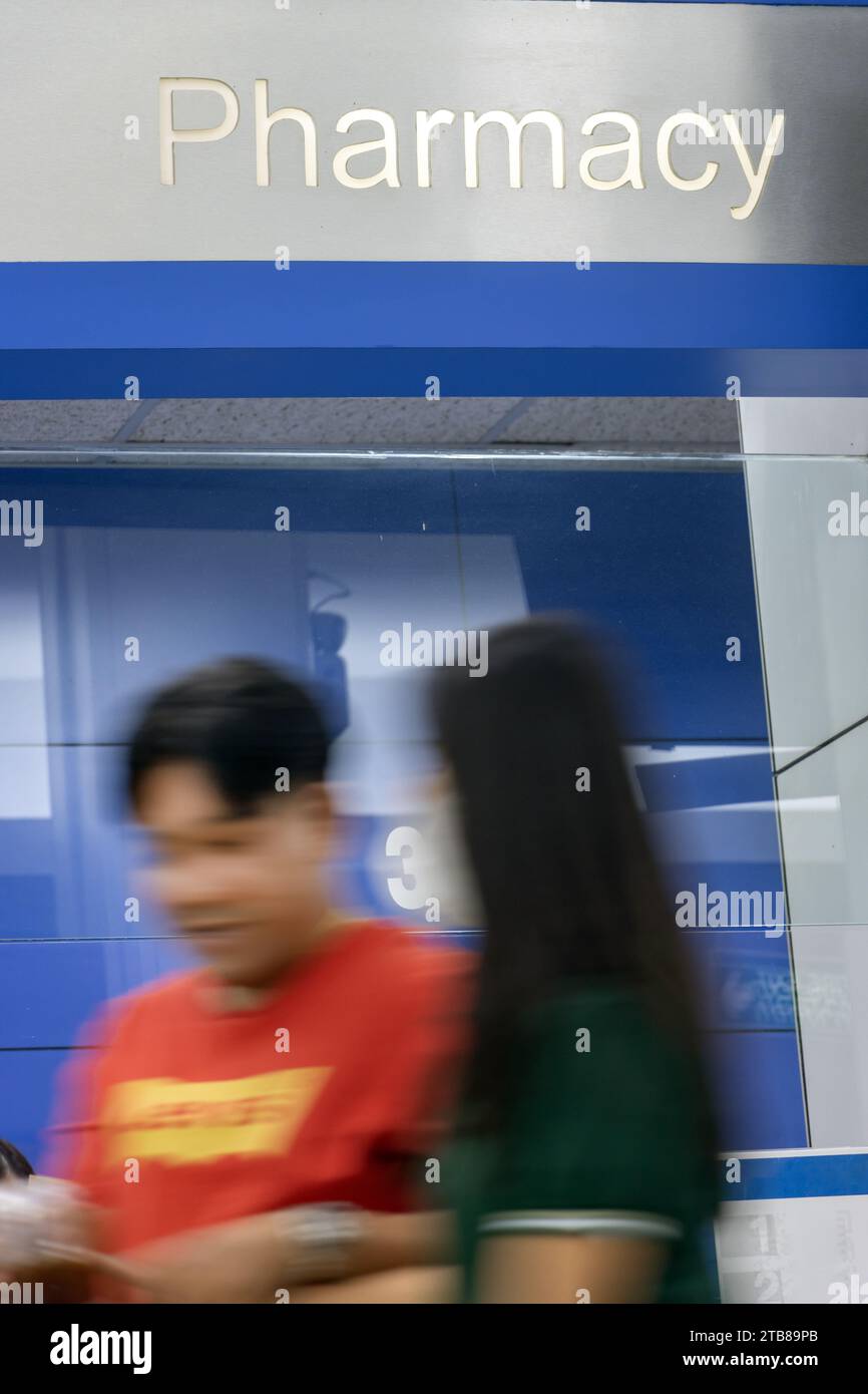 Pharmacy dispensing window with motion blurred people Stock Photo - Alamy
