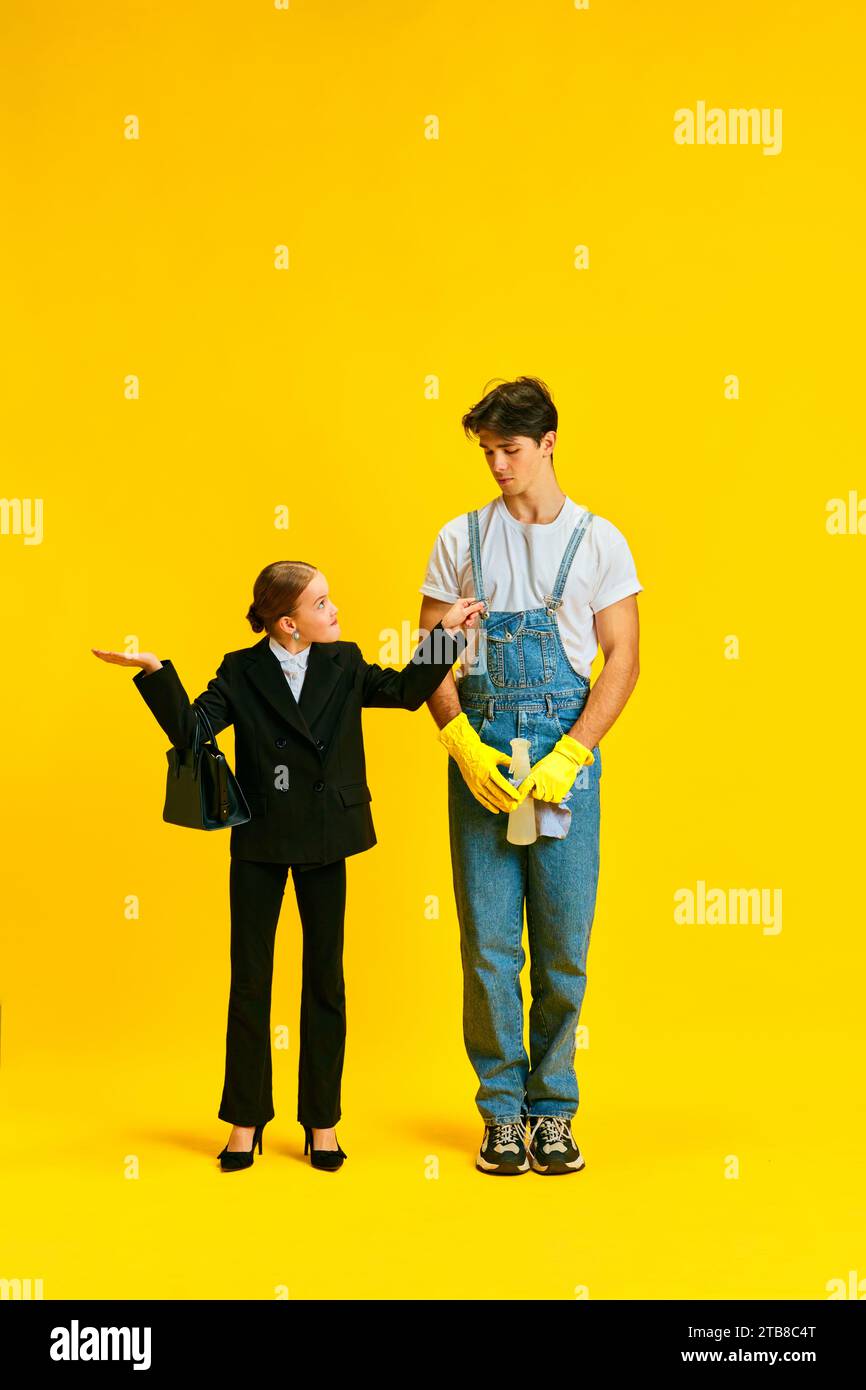 School girl dressed like boss yanking adult man, janitor, to do a ...