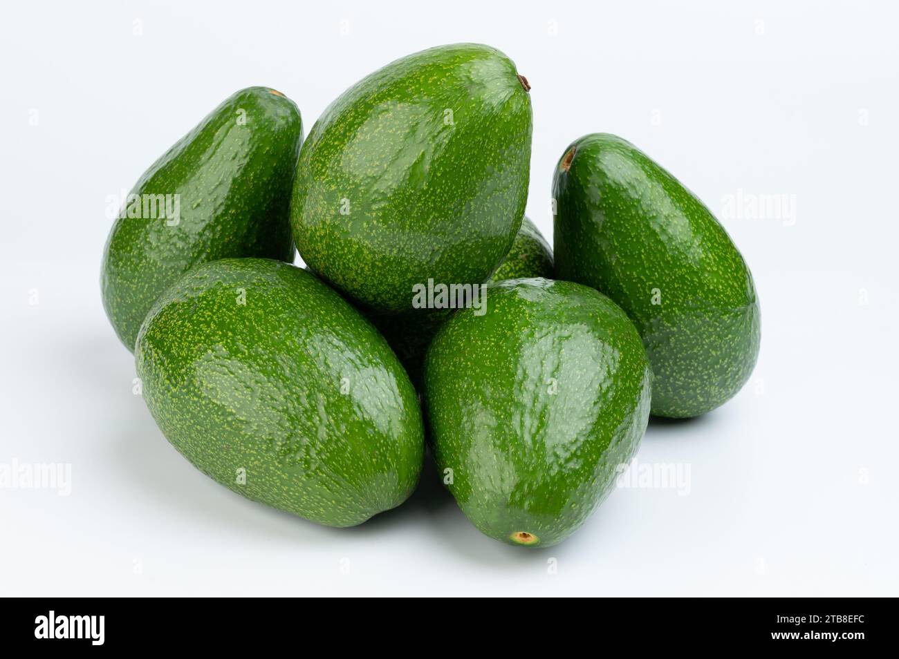Pile of group green avocados isolated on white studio background Stock ...